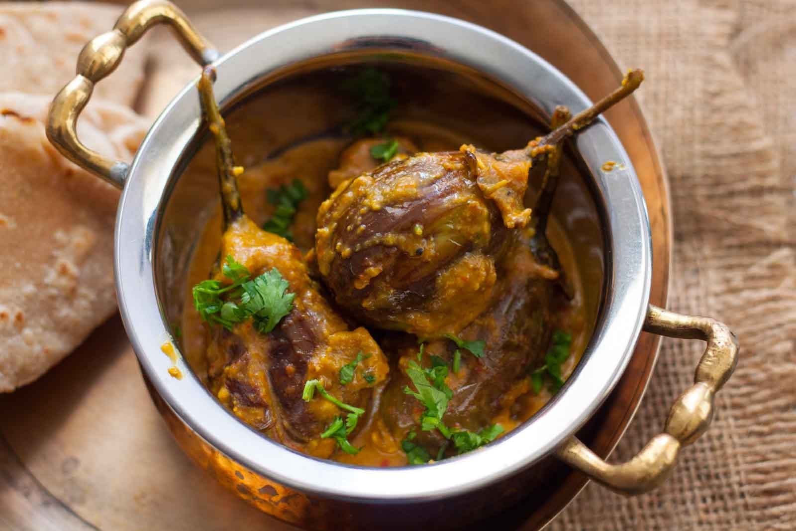 Karnataka Style Badanekai Yennegai Gojju Recipe (Stuffed ... | Archana ...